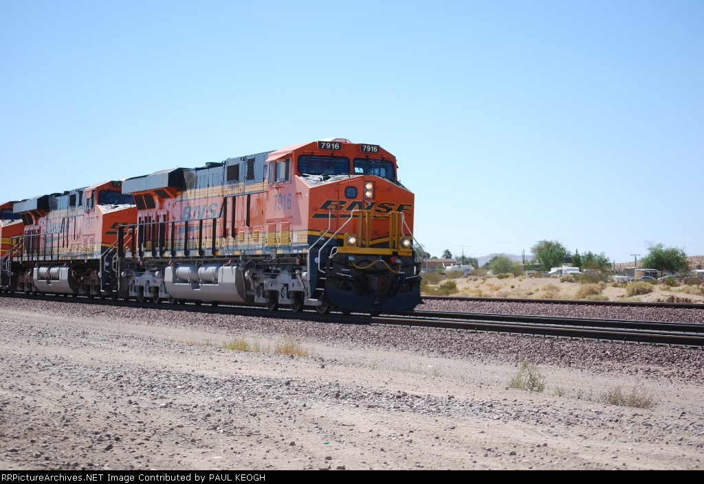 BNSF 7916 rolls almost pass me as she pulls a Z-Train into the BNSF Barstow yard.